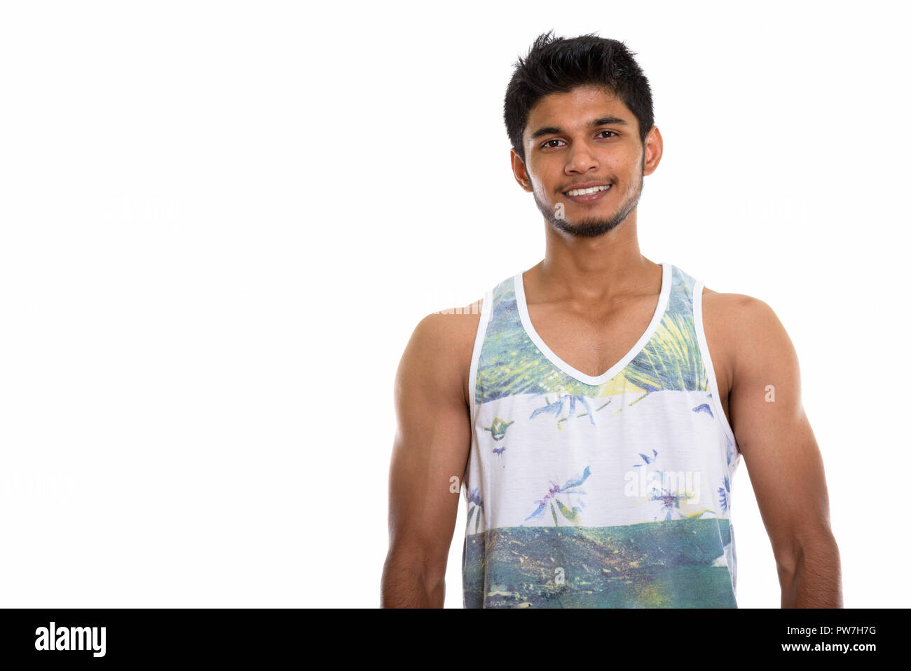 Studio shot of young happy Indian man smiling Stock Photo - Alamy