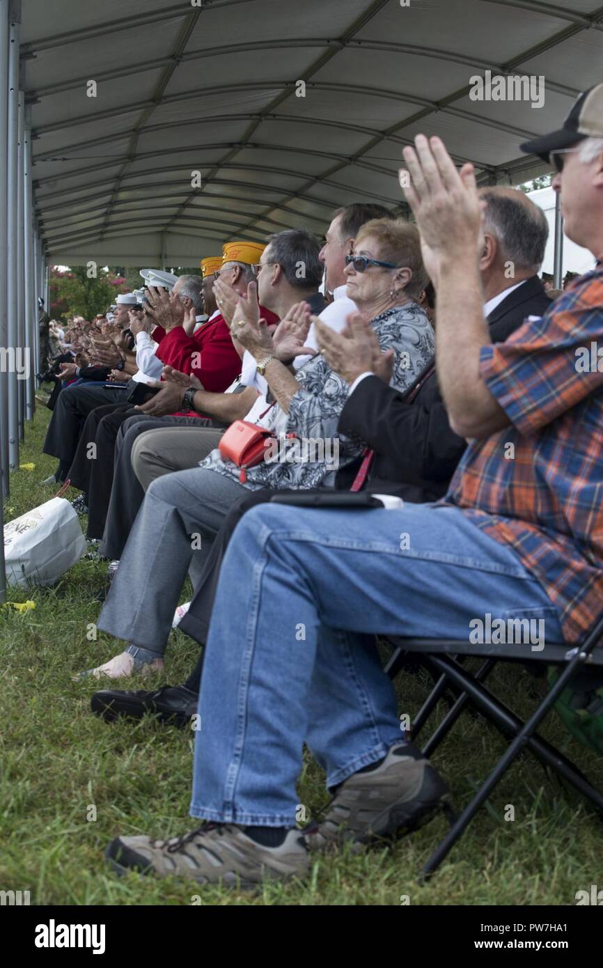 The audience applauds the U.S. Marine Corps Commandant’s Own Drum and ...