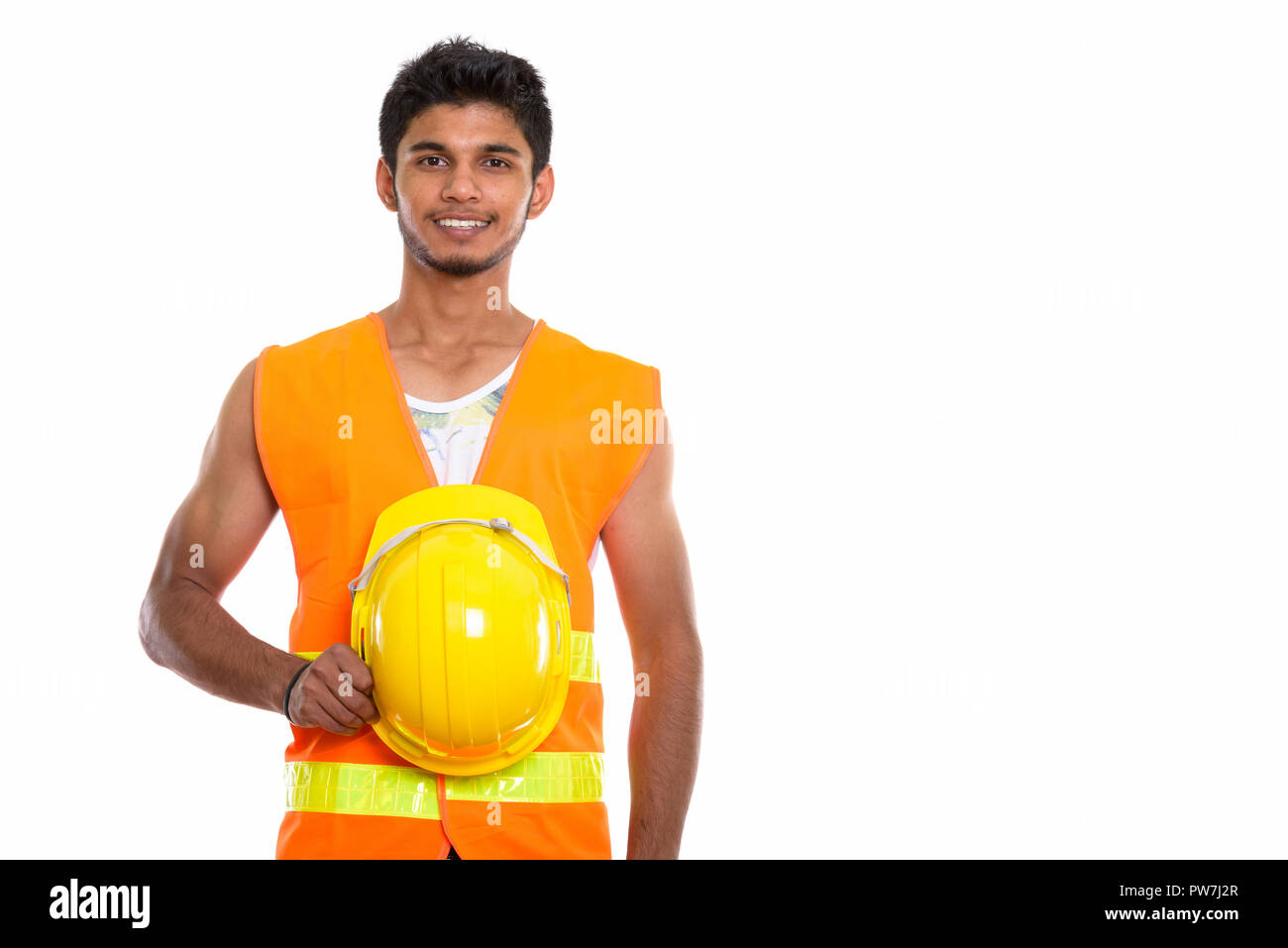 Young happy Indian man construction worker smiling while holding Stock ...