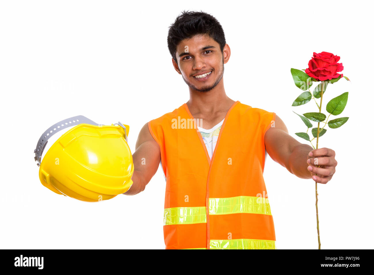 Young happy Indian man construction worker smiling while giving Stock ...