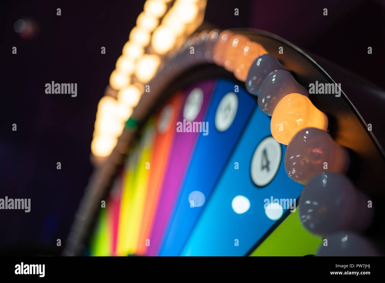 Arcade gambling machine up close. Giant wheel with colorful sections ...