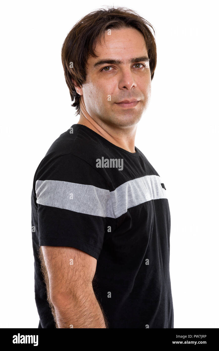 Studio shot of young Persian man standing Stock Photo - Alamy