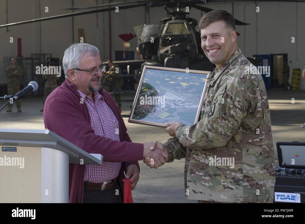 Col. Clair A. Gill, 10th Combat Aviation Brigade commander, receives an ...