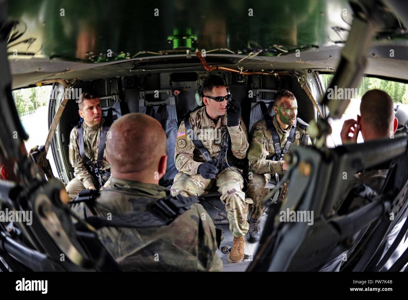 U.S. Army Sgt. 1st Class Ryan Meek, center, with 7th Army Training ...