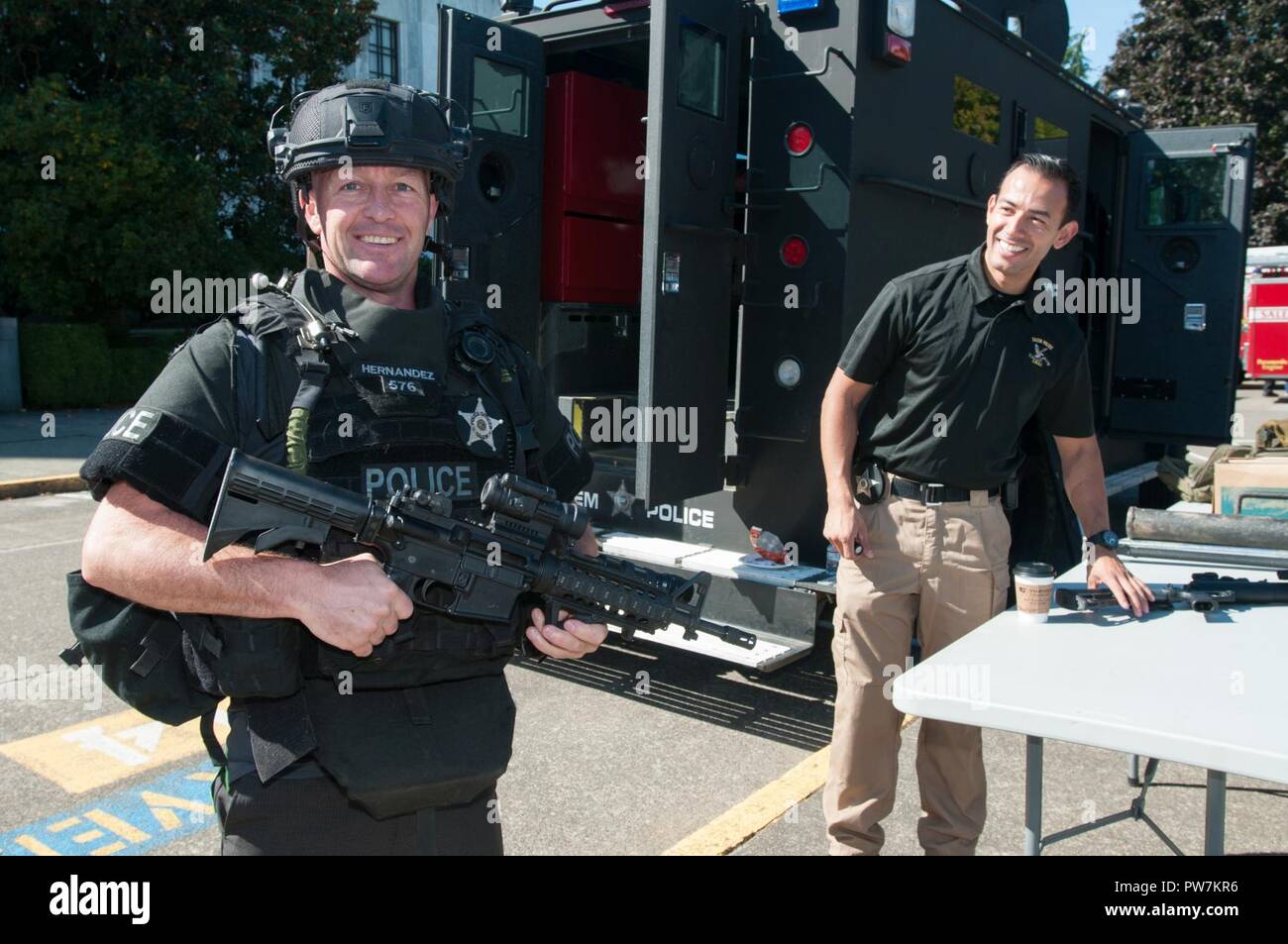 Tony Roger (left) equips himself with the gear of Officer Erick ...