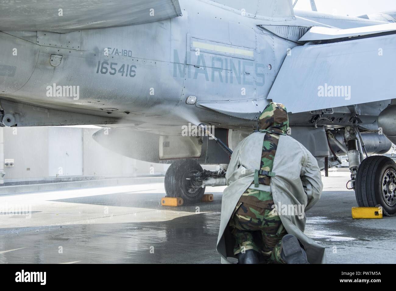 A U.S. Marine with Marine Aircraft Group (MAG) 12 Chemical Biological ...