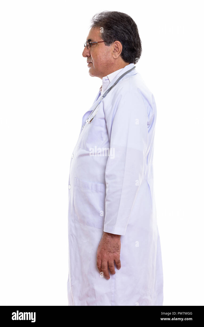 Profile view of senior Persian man doctor standing Stock Photo - Alamy
