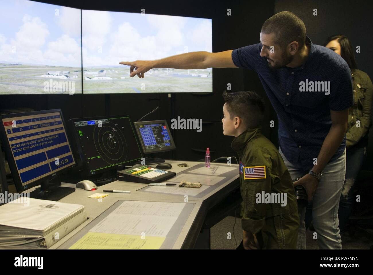 Toby Lee and his father Jared Lee interact during a tour of the air ...