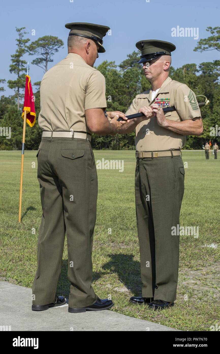 U.S. Marine Corps Col. Adam L. Chalkley, left, commanding officer of ...