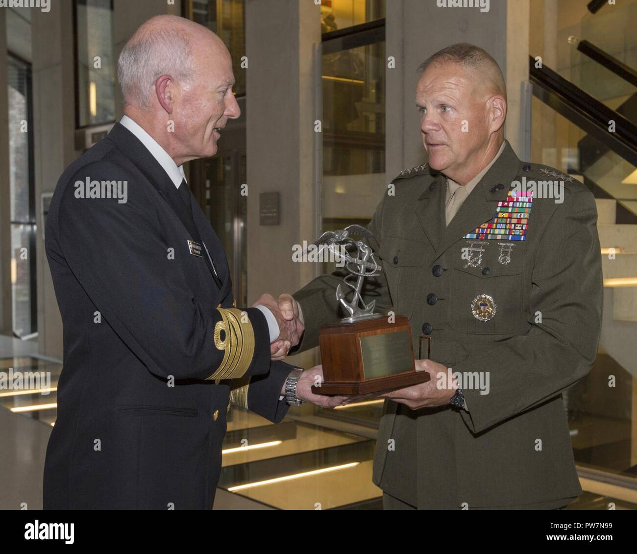 Commandant of the Marine Corps Gen. Robert B. Neller, right, shakes ...