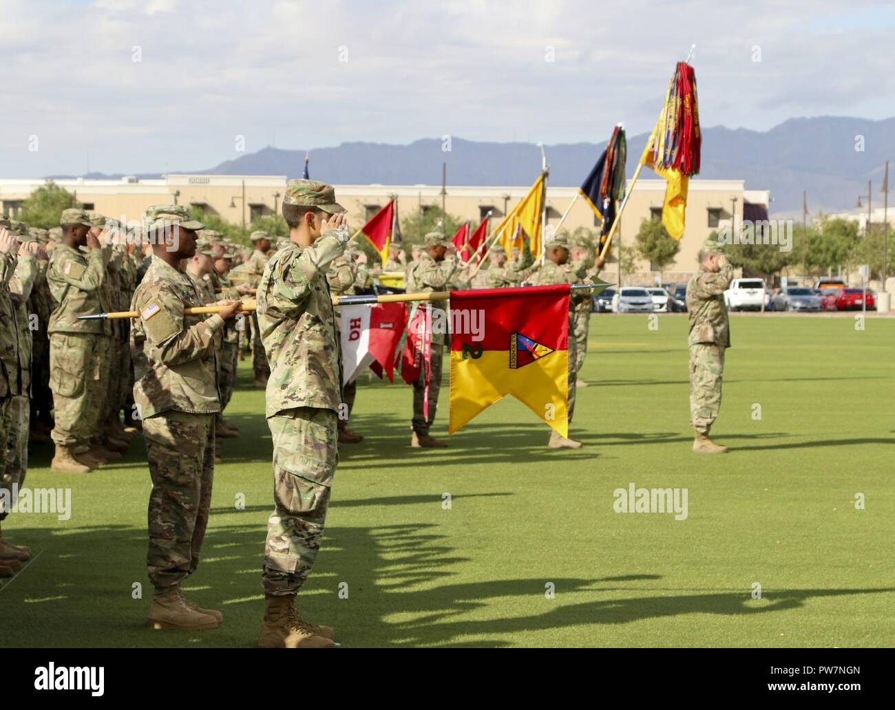 Soldiers from 2nd Brigade Combat Team, 1st Armored Division, salute the ...