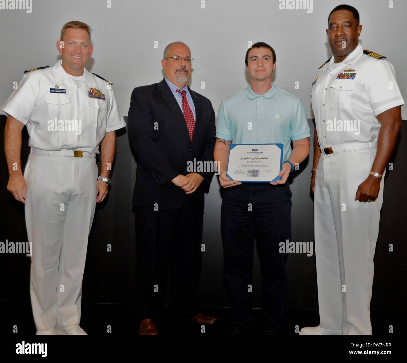 DAHLGREN, Va. - David Frederickson receives his certificate of ...