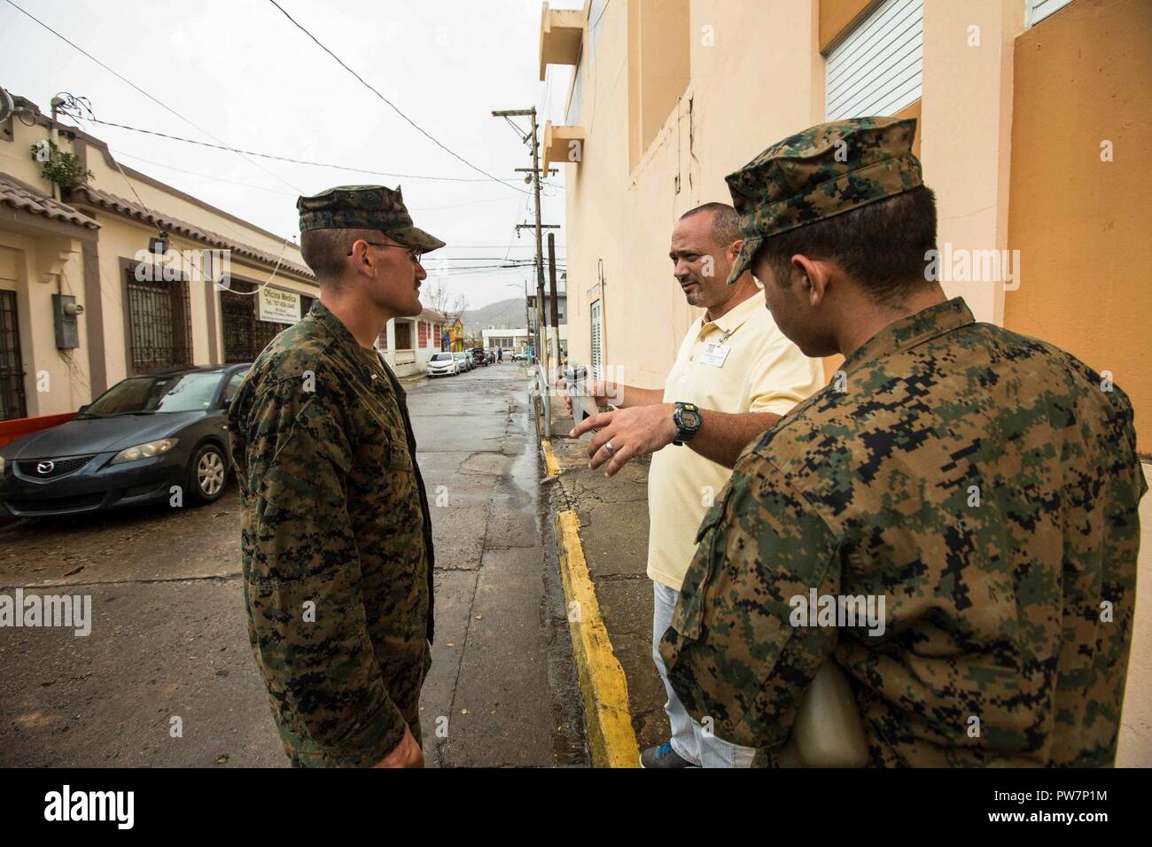 U.S. Marine 1st Lt. Charles V. McCole, left, an officer with the Air ...