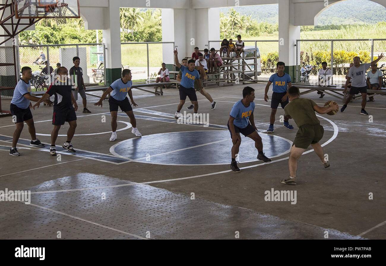 The Philippine National Police play a game of basketball against the ...