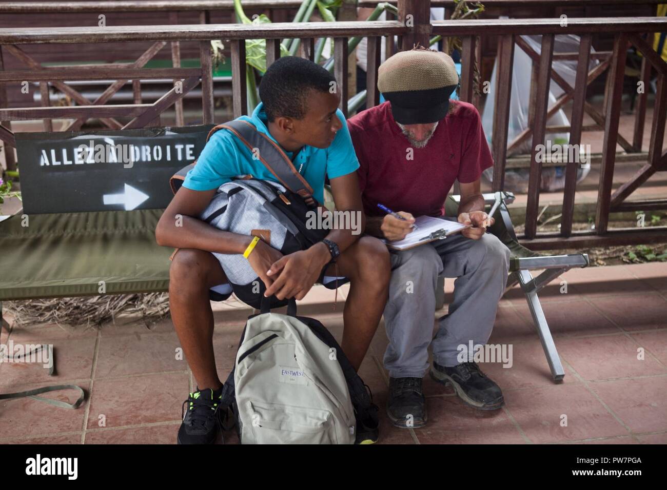 U.S. citizens Naya Shargel and his father, David Shargel, fill out ...