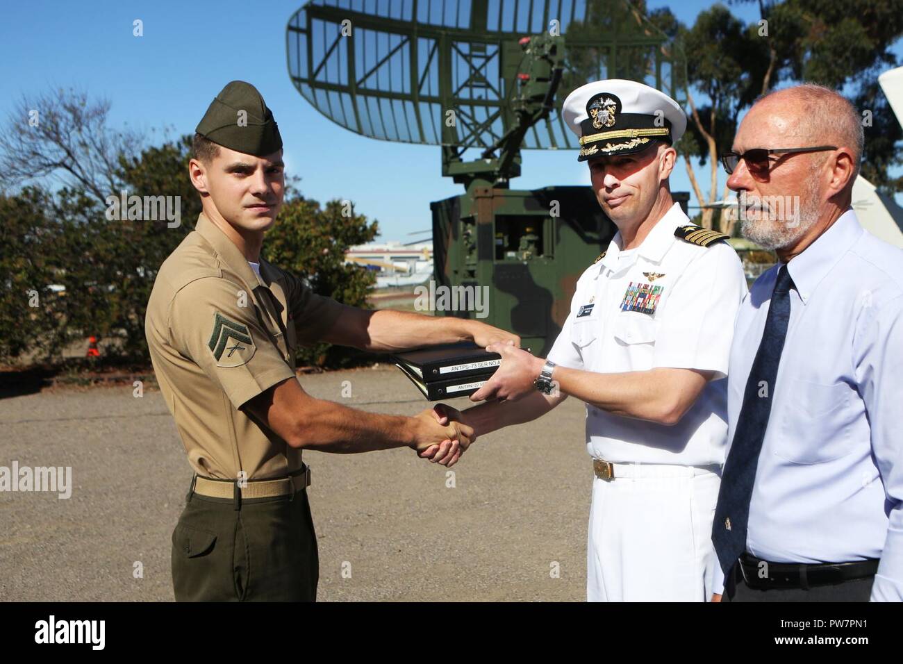 Capt. Joseph Hornbuckle III, right, the Naval Air Traffic Management ...