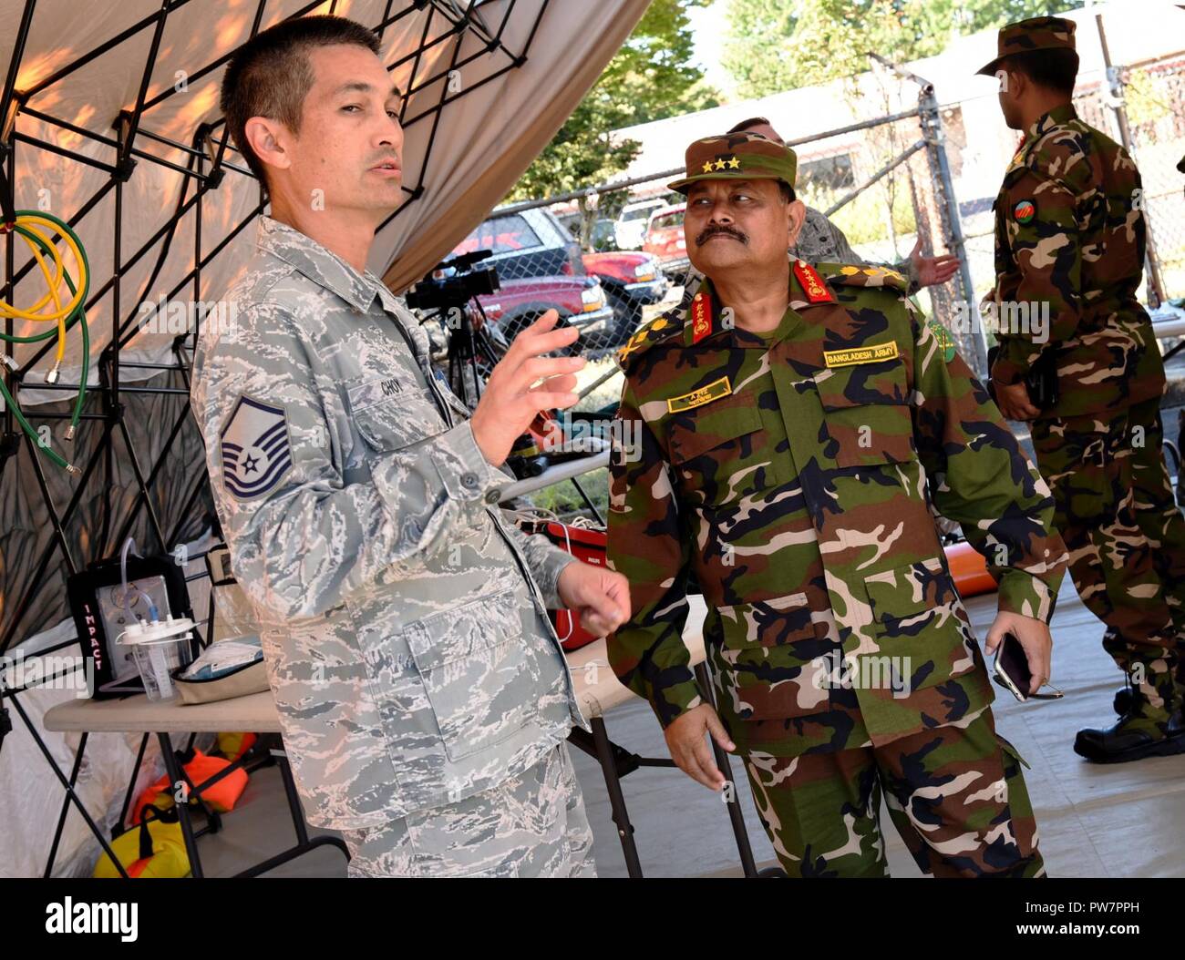 Oregon Air National Guard Master Sgt. Nick Choy (left) leads a ...
