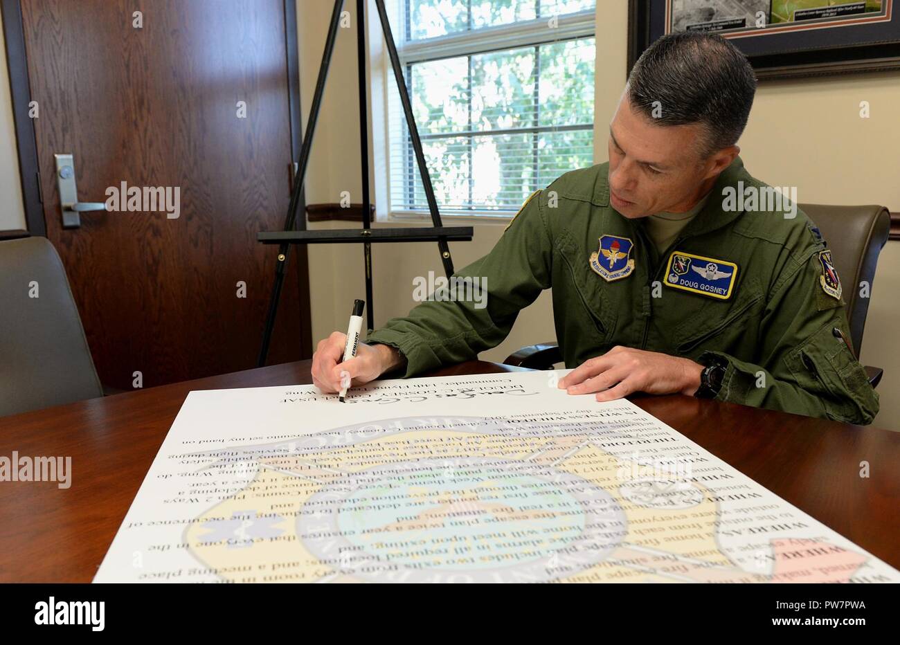 Col. Douglas Gosney, 14th Flying Training Wing Commander, signs the ...