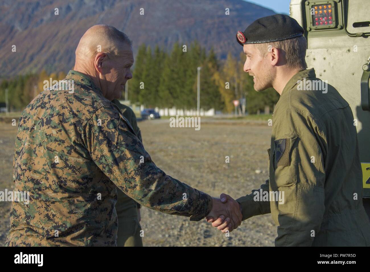 Commandant of the Marine Corps Gen. Robert B. Neller, left, shakes ...