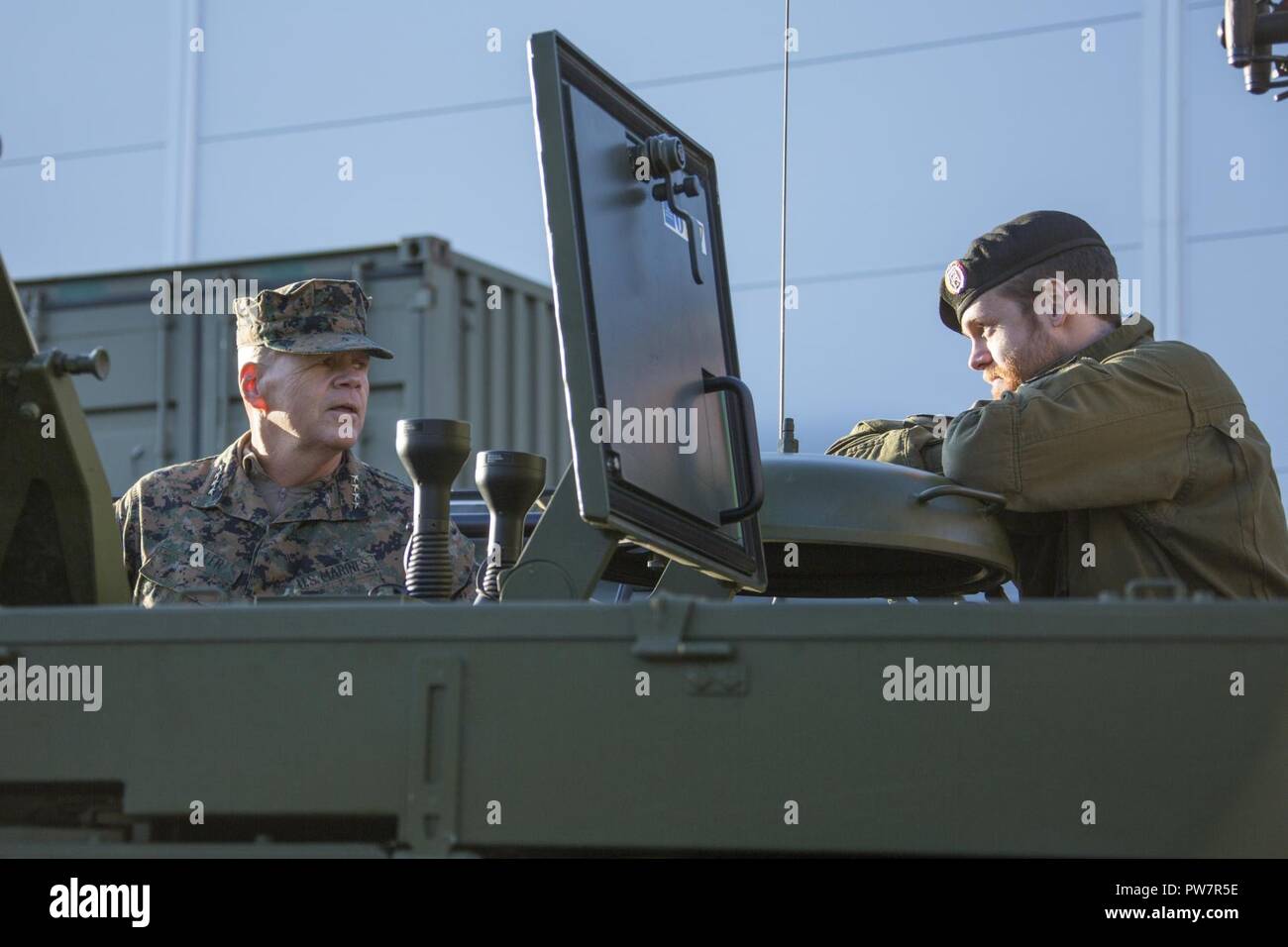 Commandant of the Marine Corps Gen. Robert B. Neller, left, speaks with ...