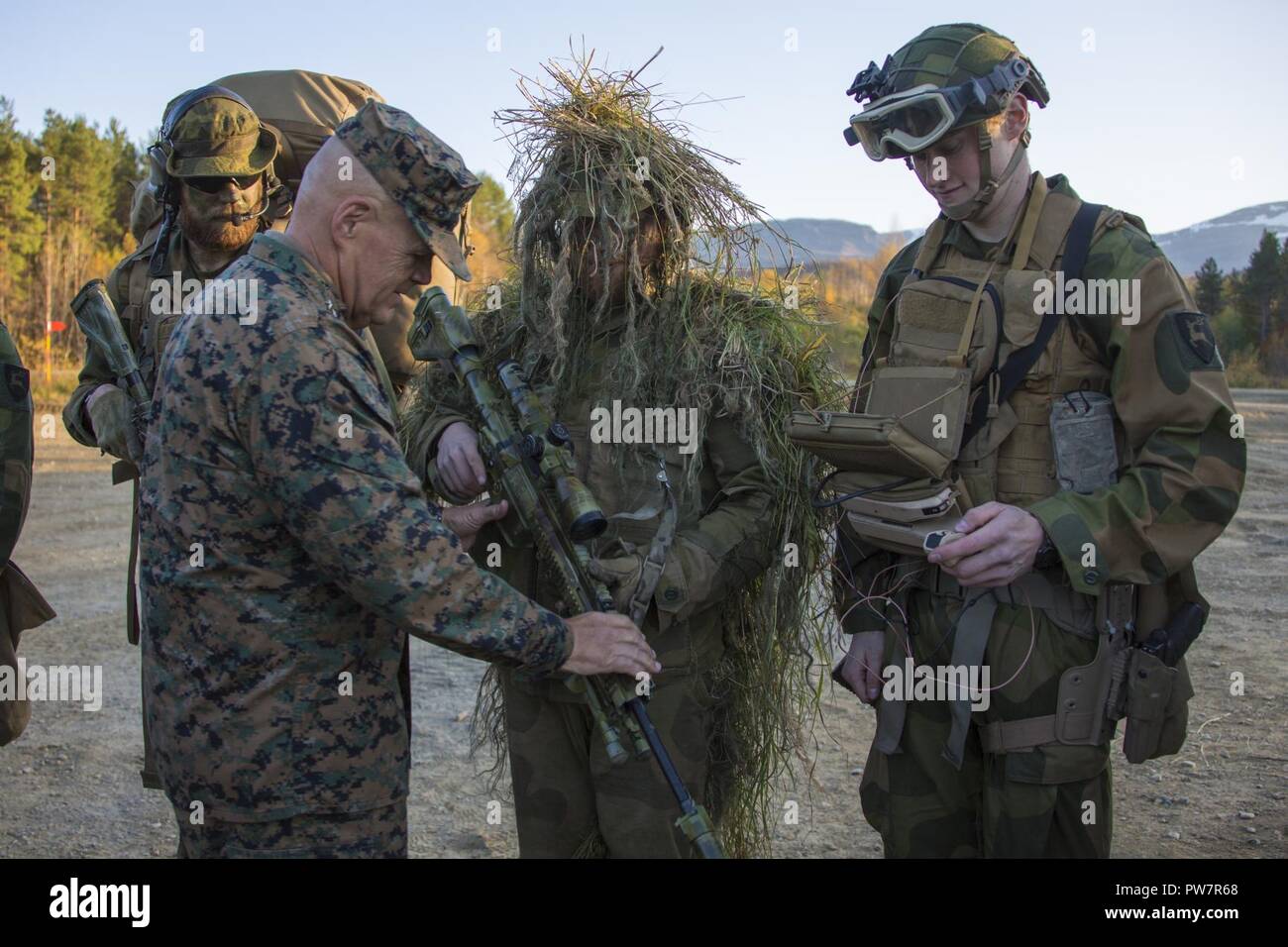 Commandant of the Marine Corps Gen. Robert B. Neller, left, observes an ...