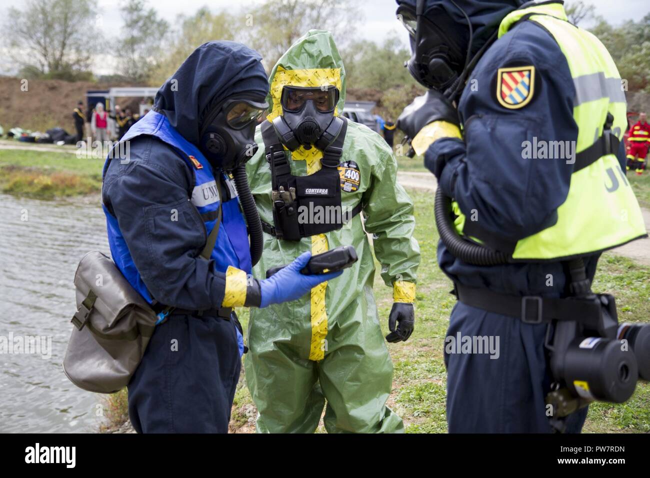 Staff Sgt. Patrick McNeely (middle), chemical, biological, radiological ...