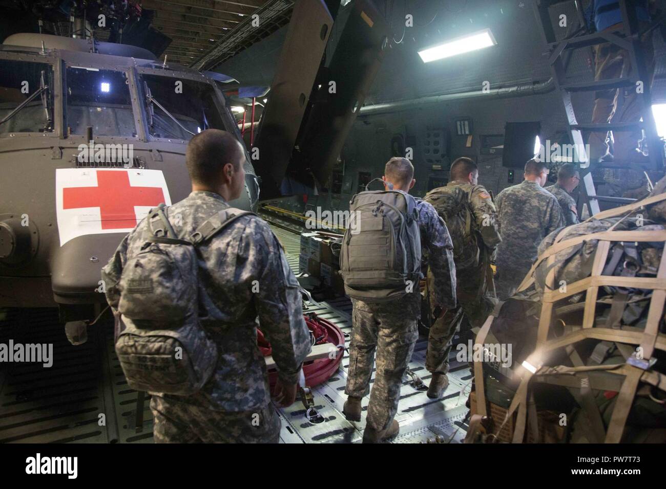 U.S. Soldiers assigned to the 101st Combat Aviation Brigade (CAB) exit ...