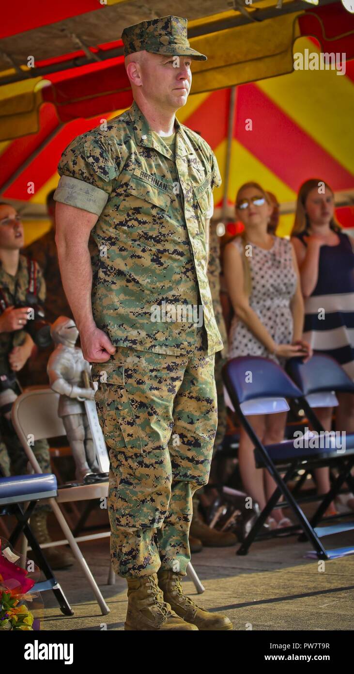 Lt. Col. Michael P. Brennan Latt stands at attention during the playing ...