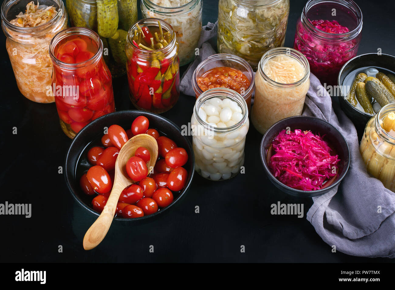 Fermented preserved food. Marinated pickles vegetables in glass jars ...
