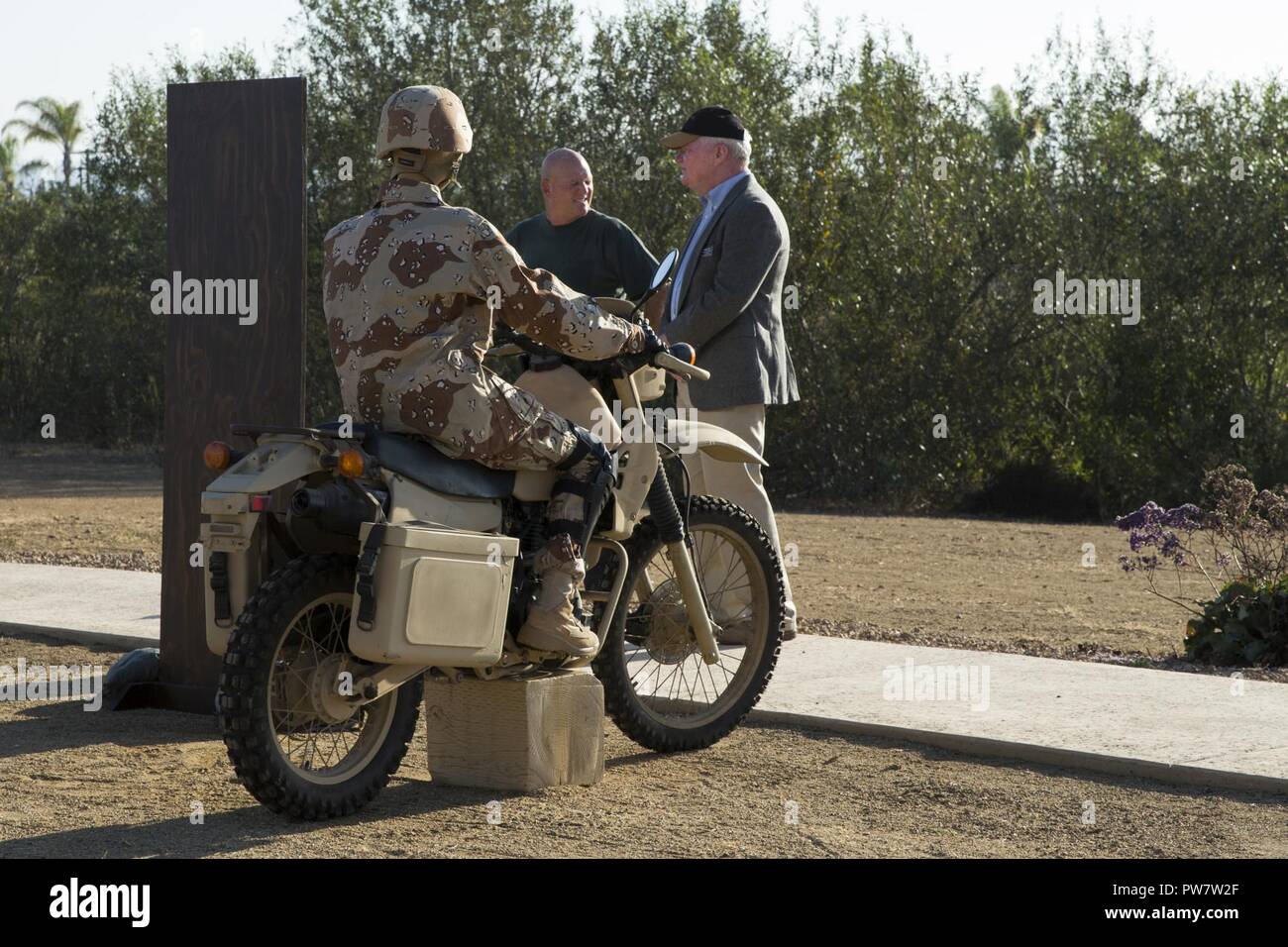 Attendees of the 75th Annual Evening Colors Ceremony view the displays ...