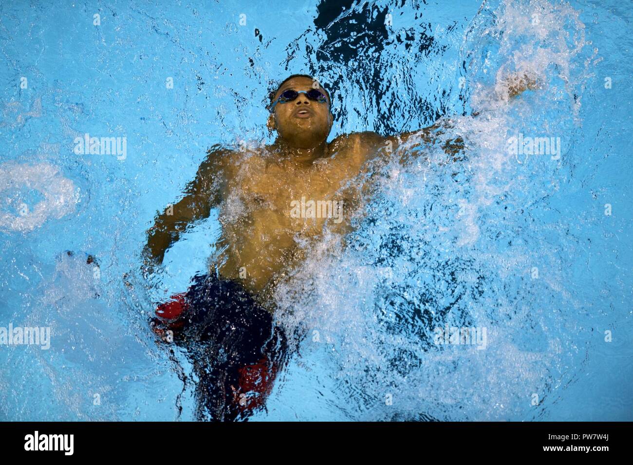 Retired Army Staff Sgt. Ryan Major swims 50 meter backstroke during the ...