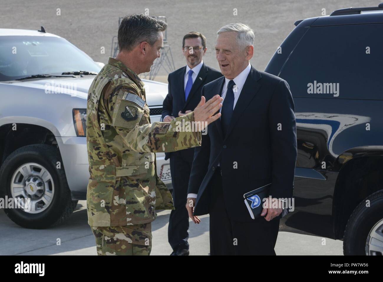 Secretary of Defense Jim Mattis speaks with U.S. Air Force Brig. Gen. Jason R. Armagost ...
