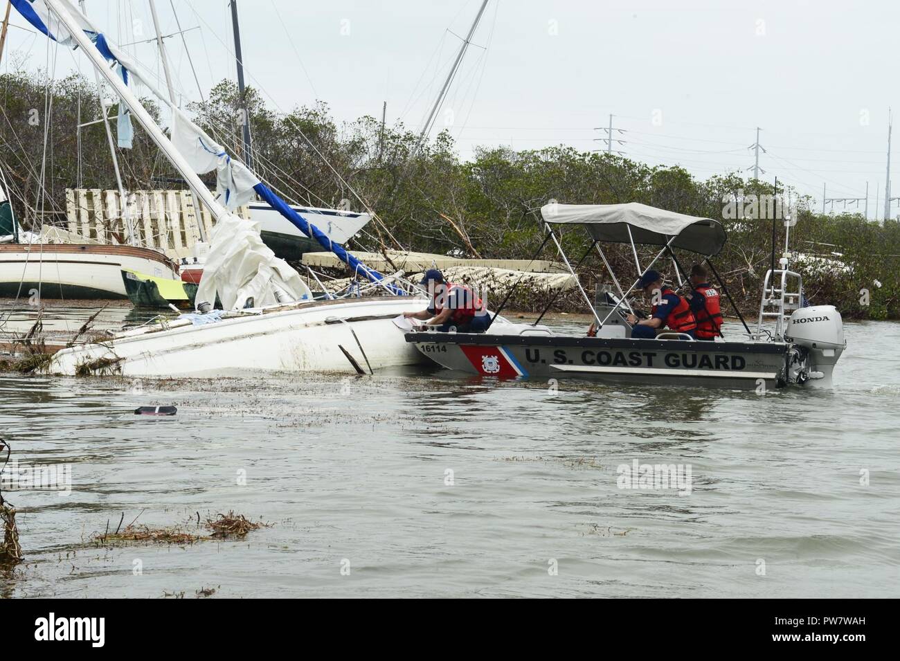 Coast Guard crewmembers with the Florida Keys Branch of the Emergency ...