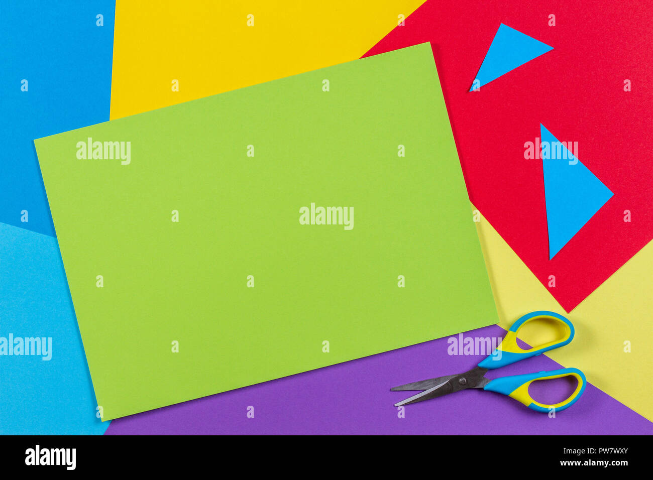 Top view of colored paper with colorful scissors. Kids art and craft ...