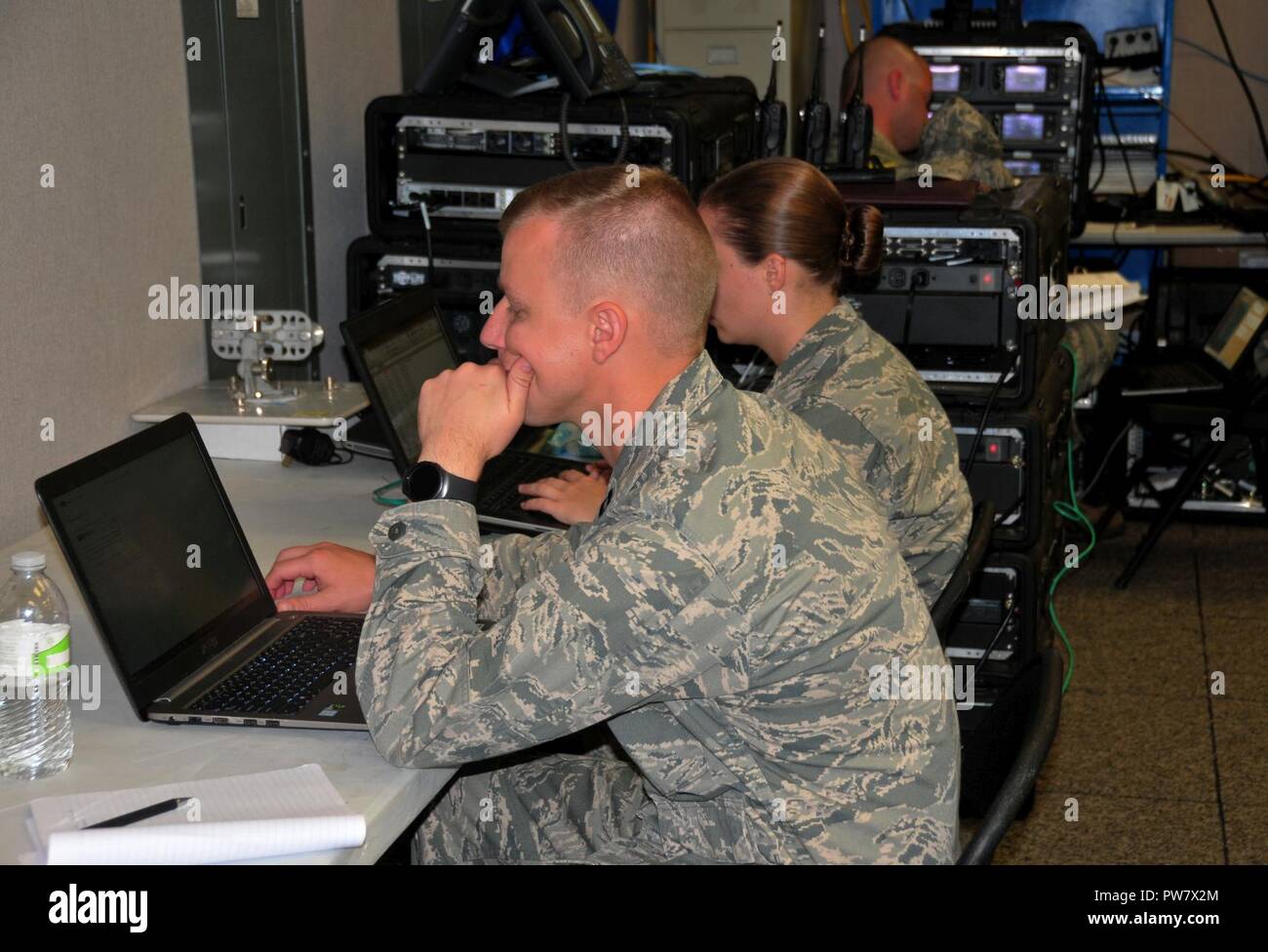 Capt. Jeff Rutkowski and members of his team work inside the Puerto ...