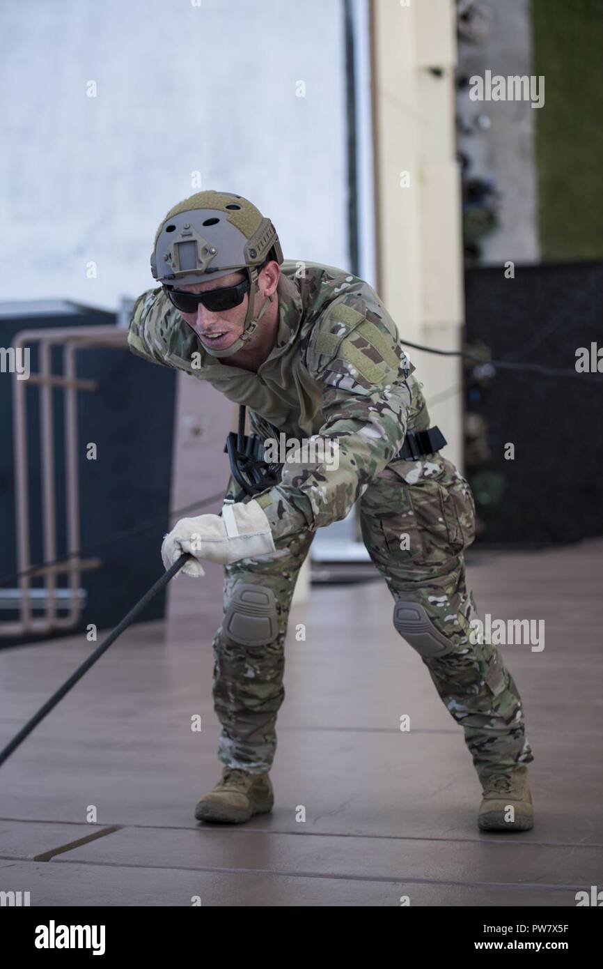 Explosive Ordnance Disposal Technician 2nd Class Cliff Lomax, assigned ...