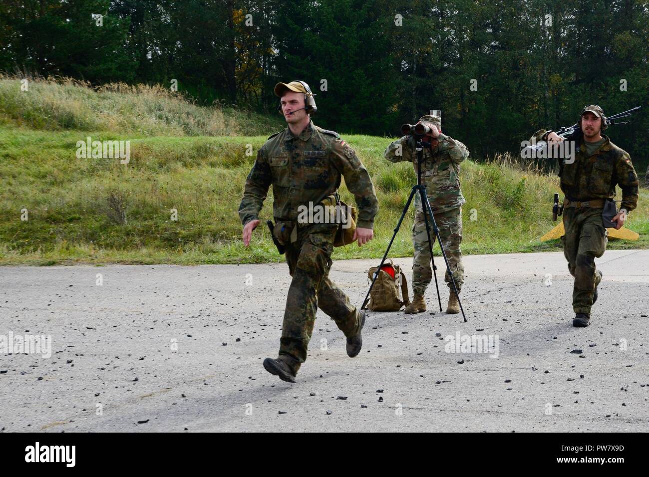 U.S. Army Col. William C. Lindner, center, the 7th Army Training ...