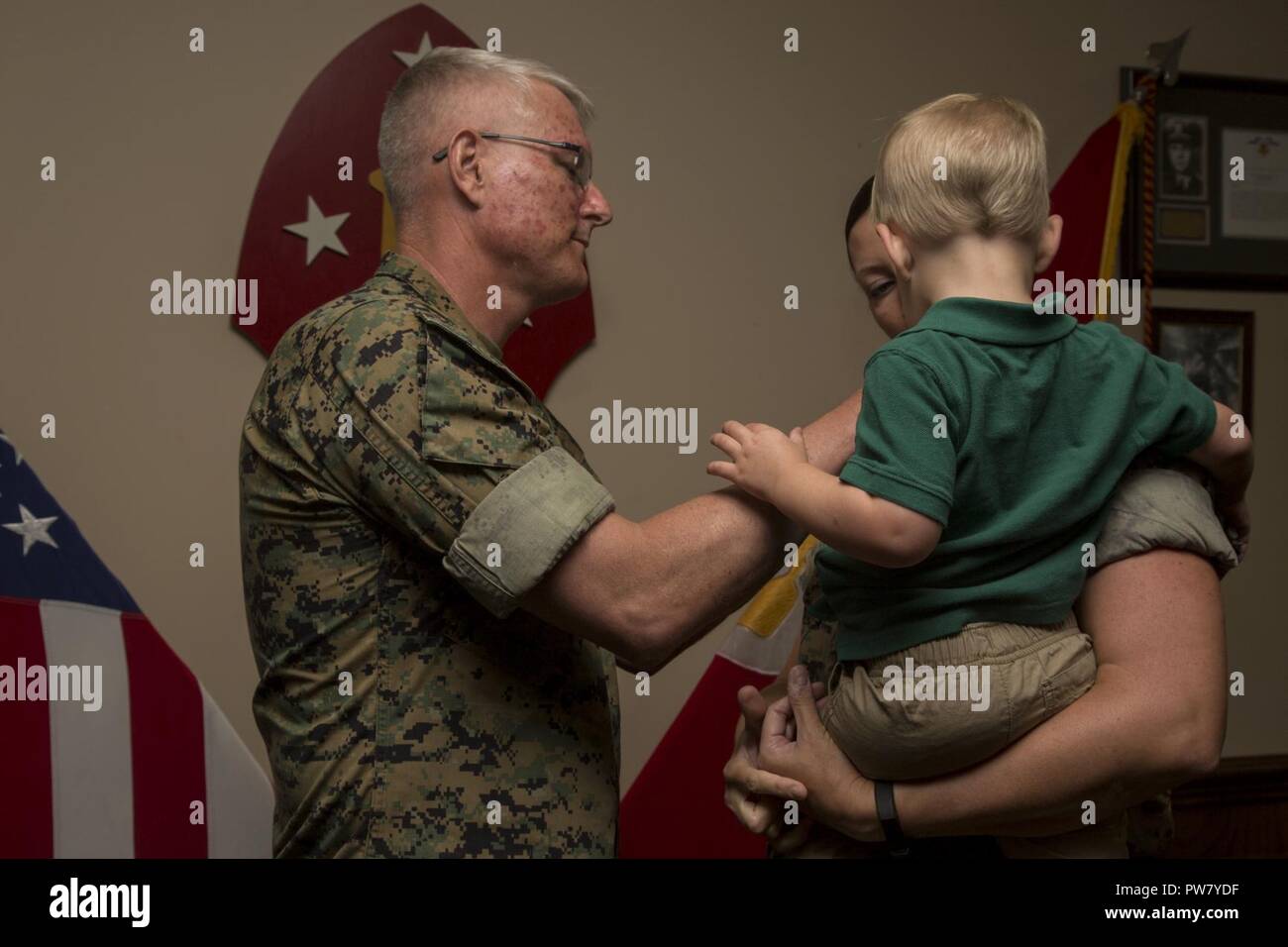 U.S. Marine Corps Lt. Col. Sarah B. Lenz is pinned by her son during ...