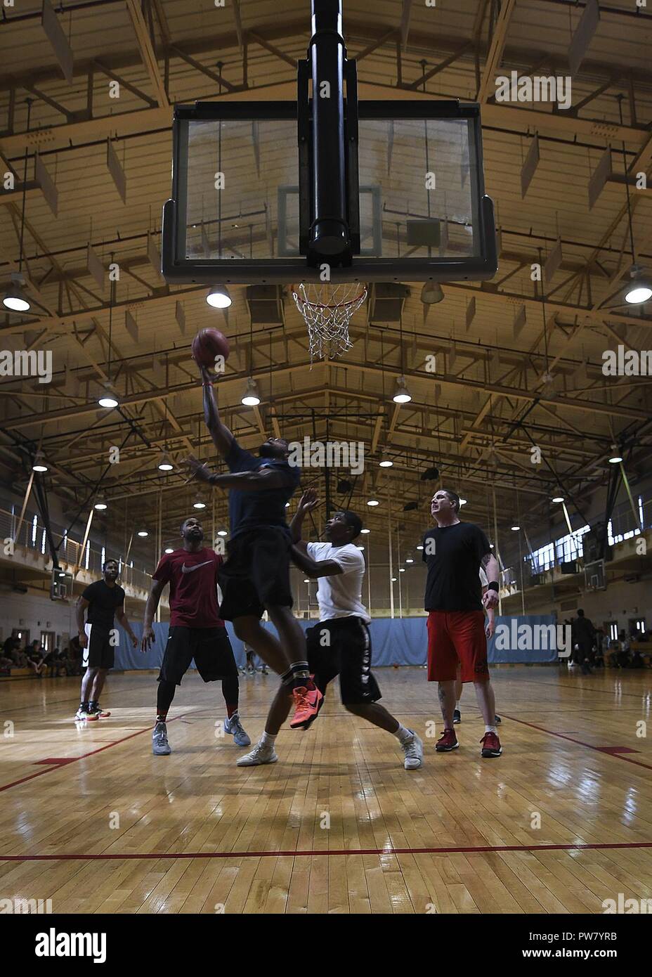 Members of Team Osan compete in a basketball tournament during the 4th ...