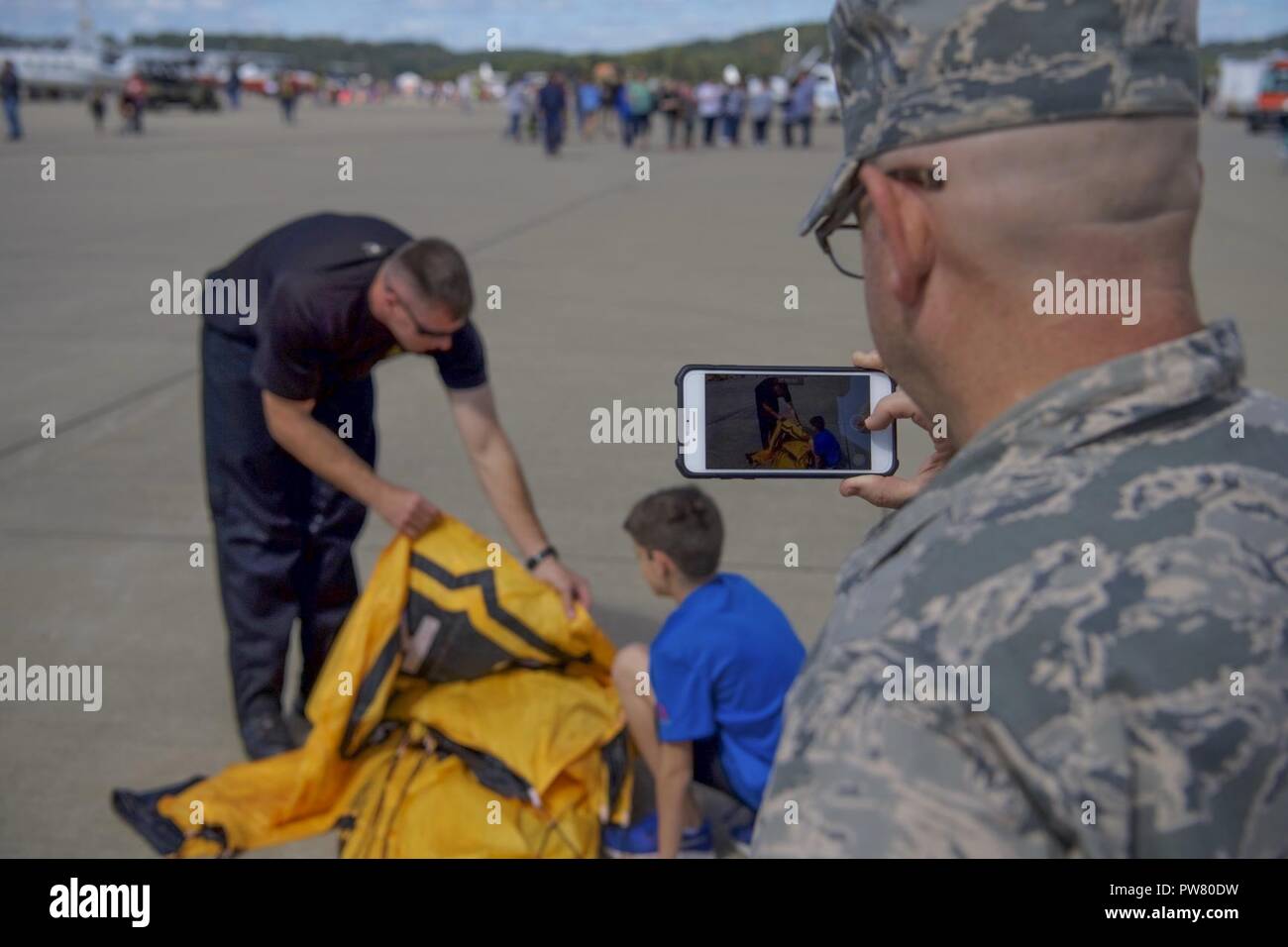 U.S. Air Force Capt. Theodore Fox snaps a picture of U.S. Army Sgt. 1st ...