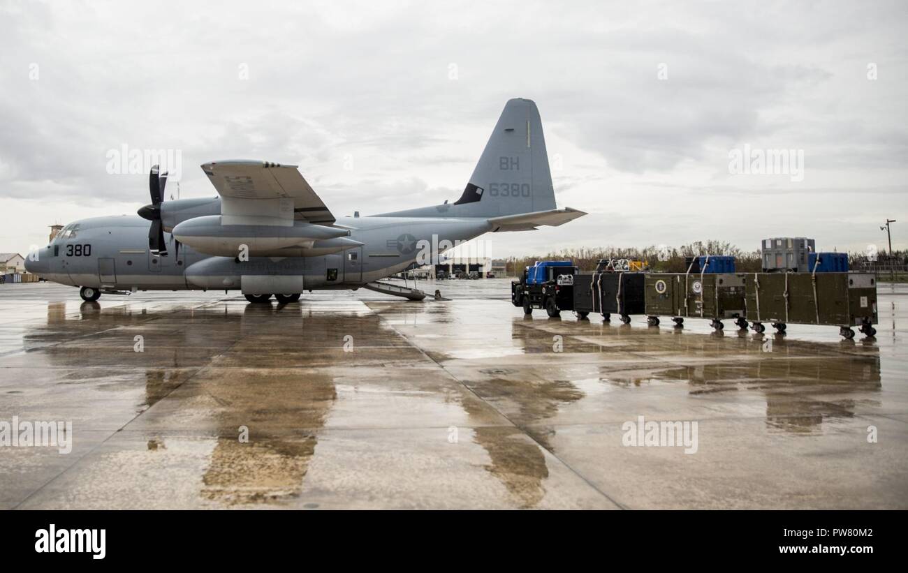 U.S. Marines with Marine Helicopter Squadron One (HMX-1) load a KC-130J ...