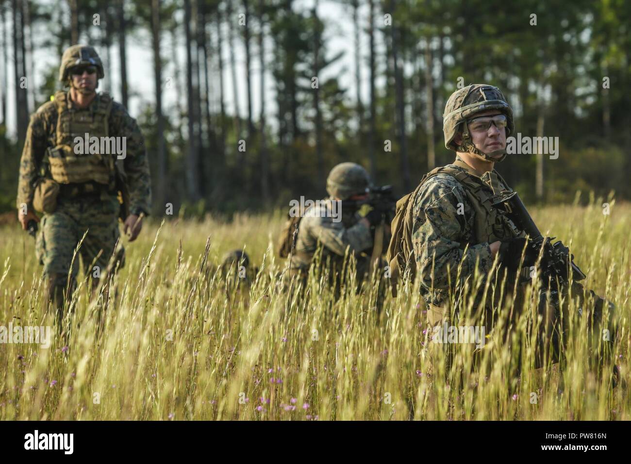 Marines shoot at targets during a cross training exercise at Camp ...