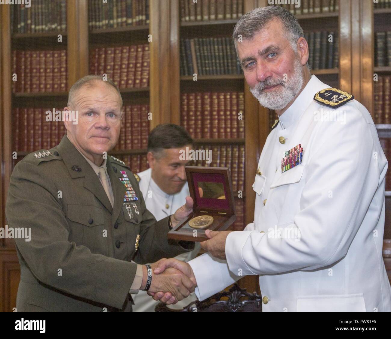 Commandant of the Marine Corps Gen. Robert B. Neller, left, shakes ...