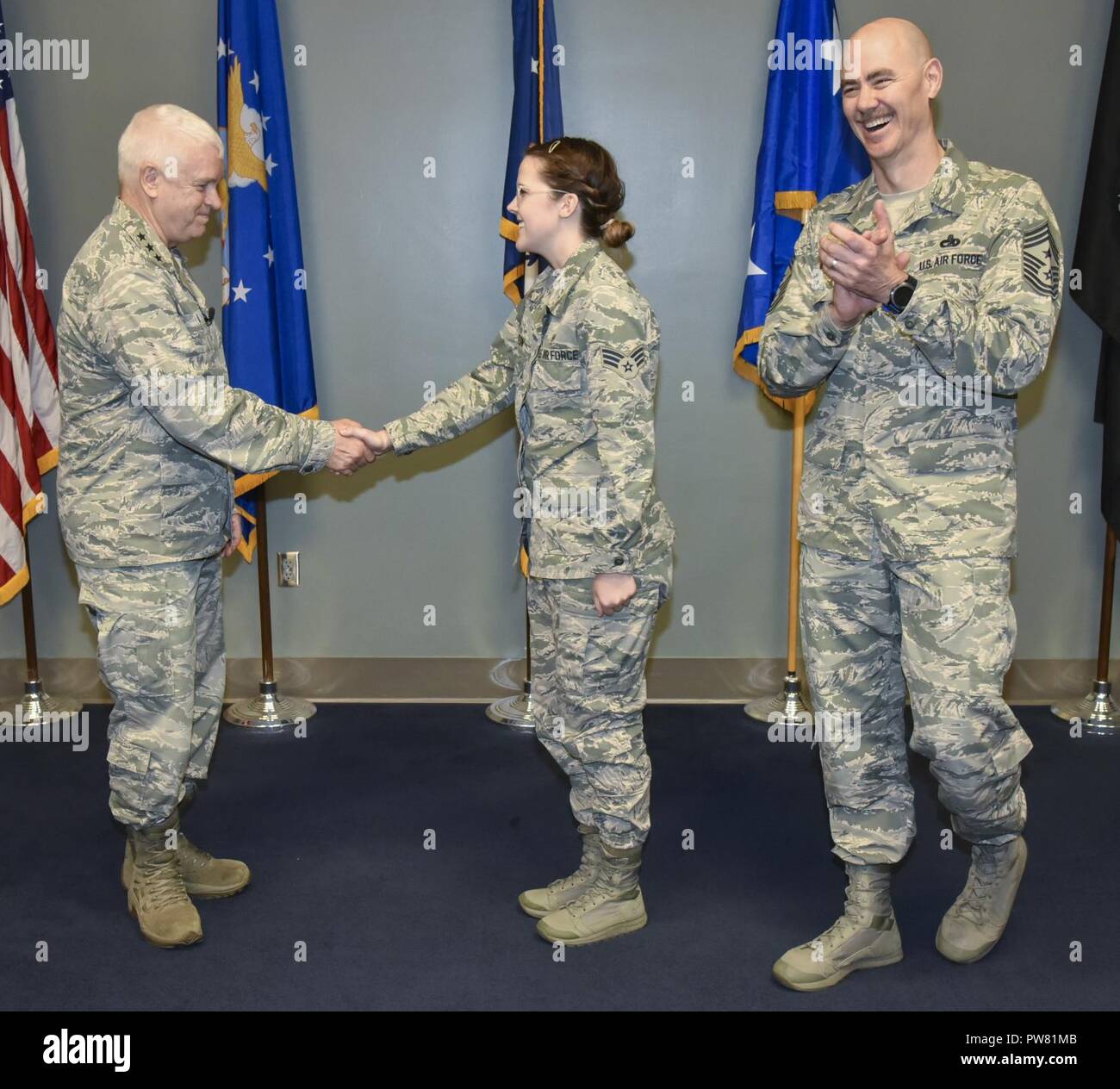 Lt. Gen. L. Scott Rice, Director, Air National Guard presents a coin to ...