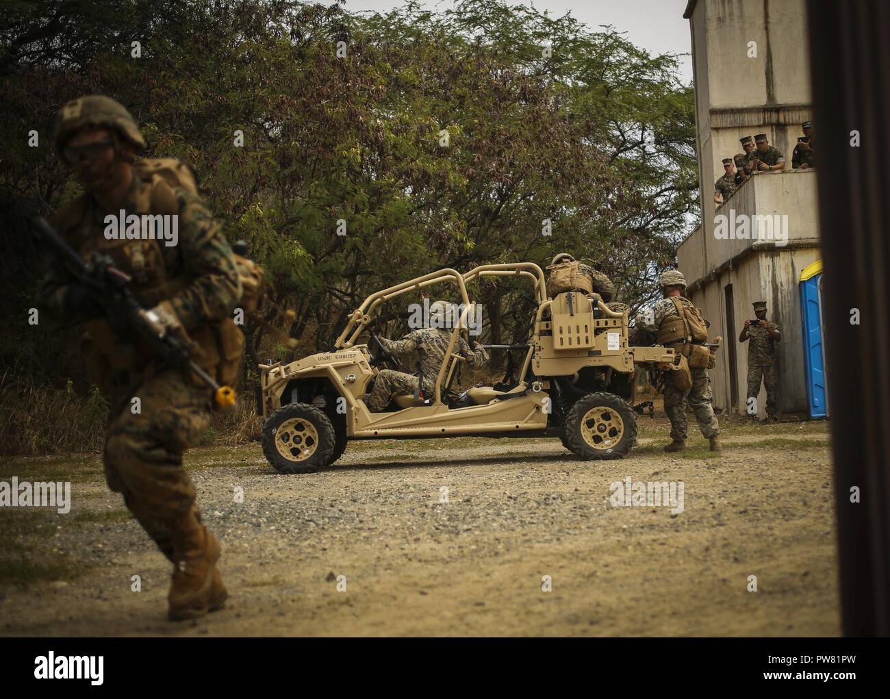 U.S. Marines with 2nd Battalion, 3rd Marines, evacuate a simulated ...