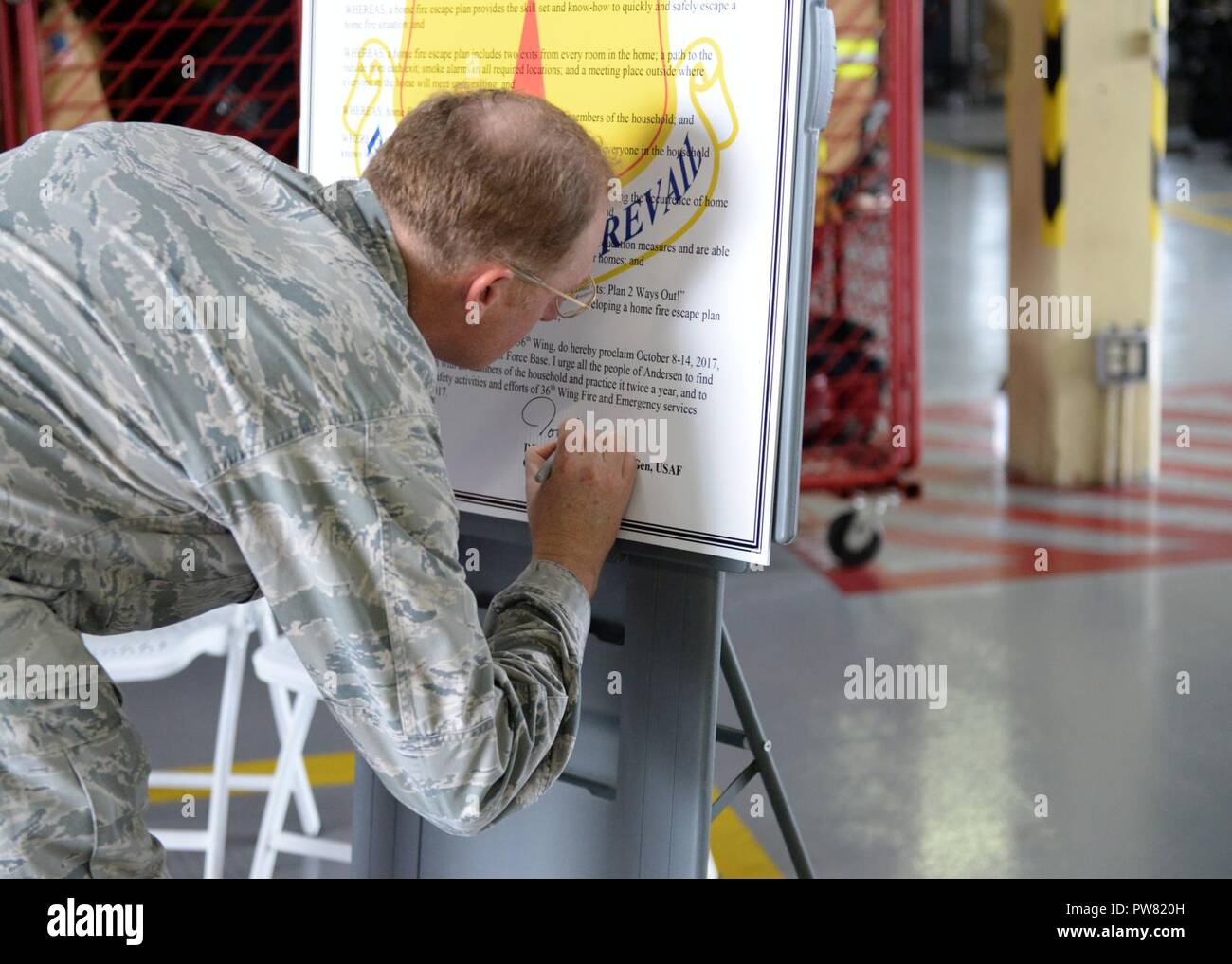 Brig. Gen. Cox signs off for Fire Safety Week. The ceremony was held at ...