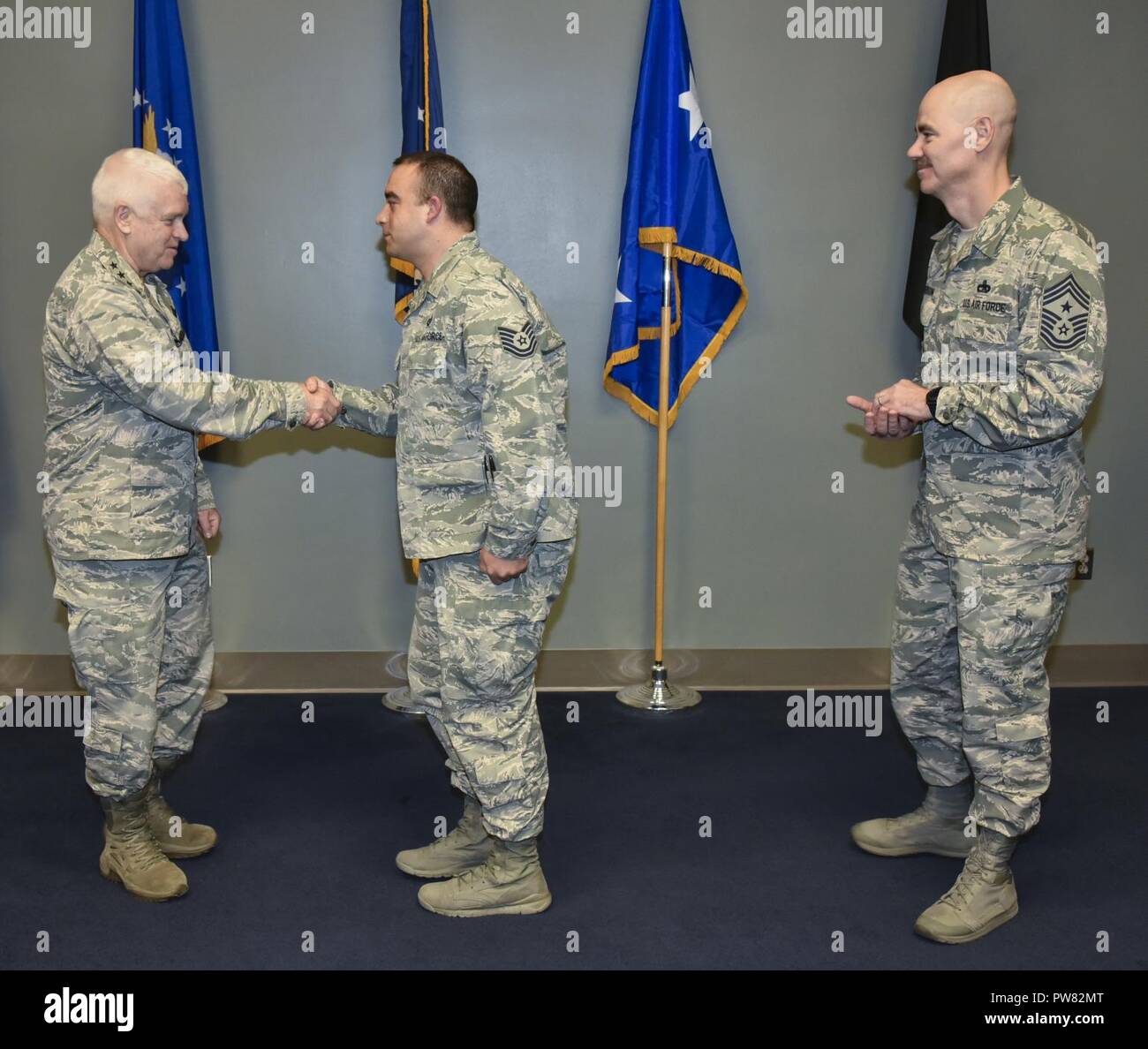 Lt. Gen. L. Scott Rice, Director, Air National Guard presents a coin to ...