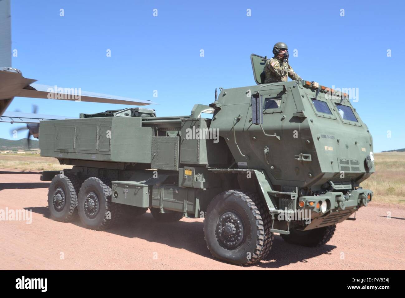 With engines still running on the C-130 Hercules aircraft from the 41st ...