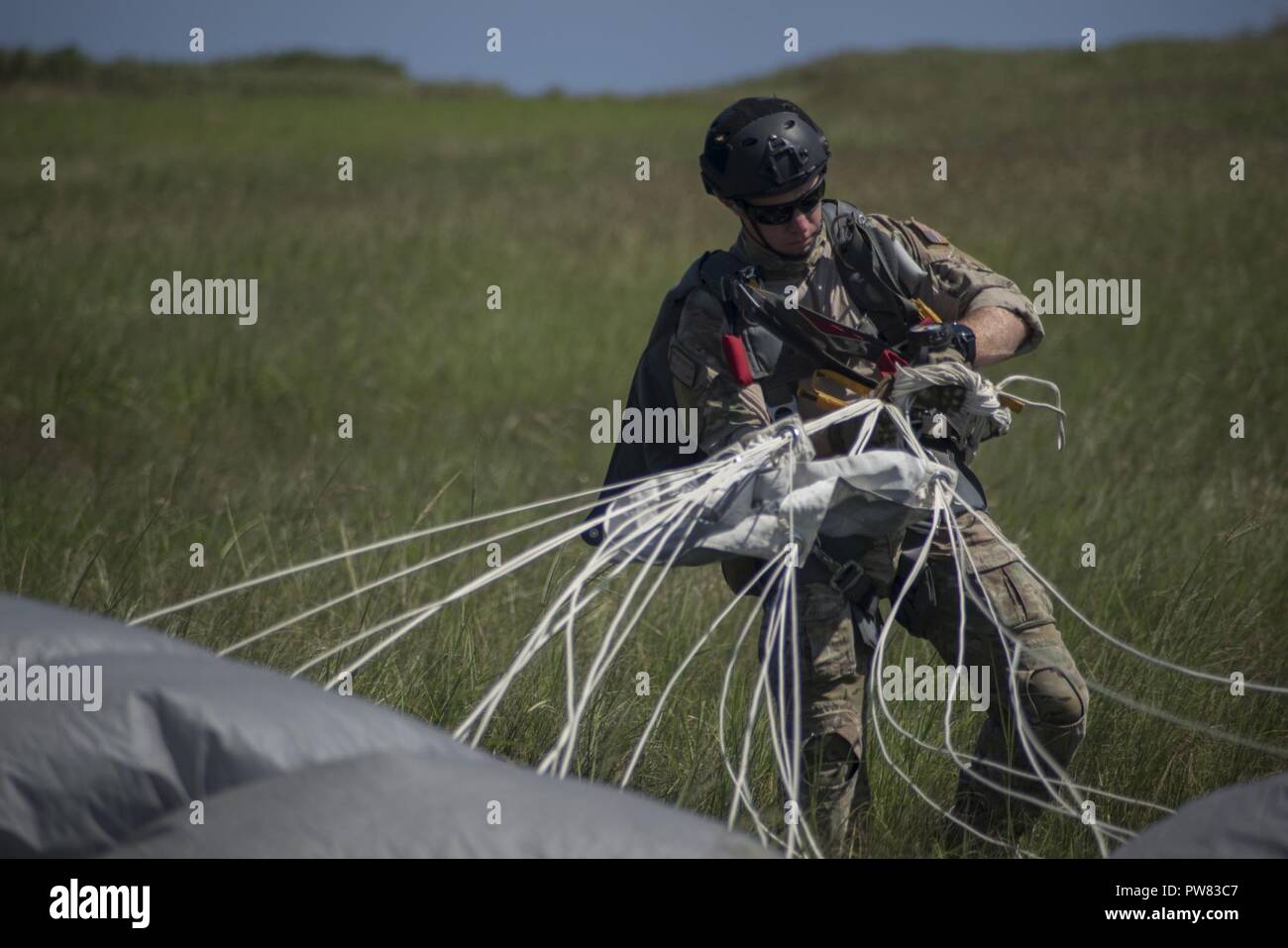 A U.S. Air Force Airman from the 31st Rescue Squadron gathers his ...