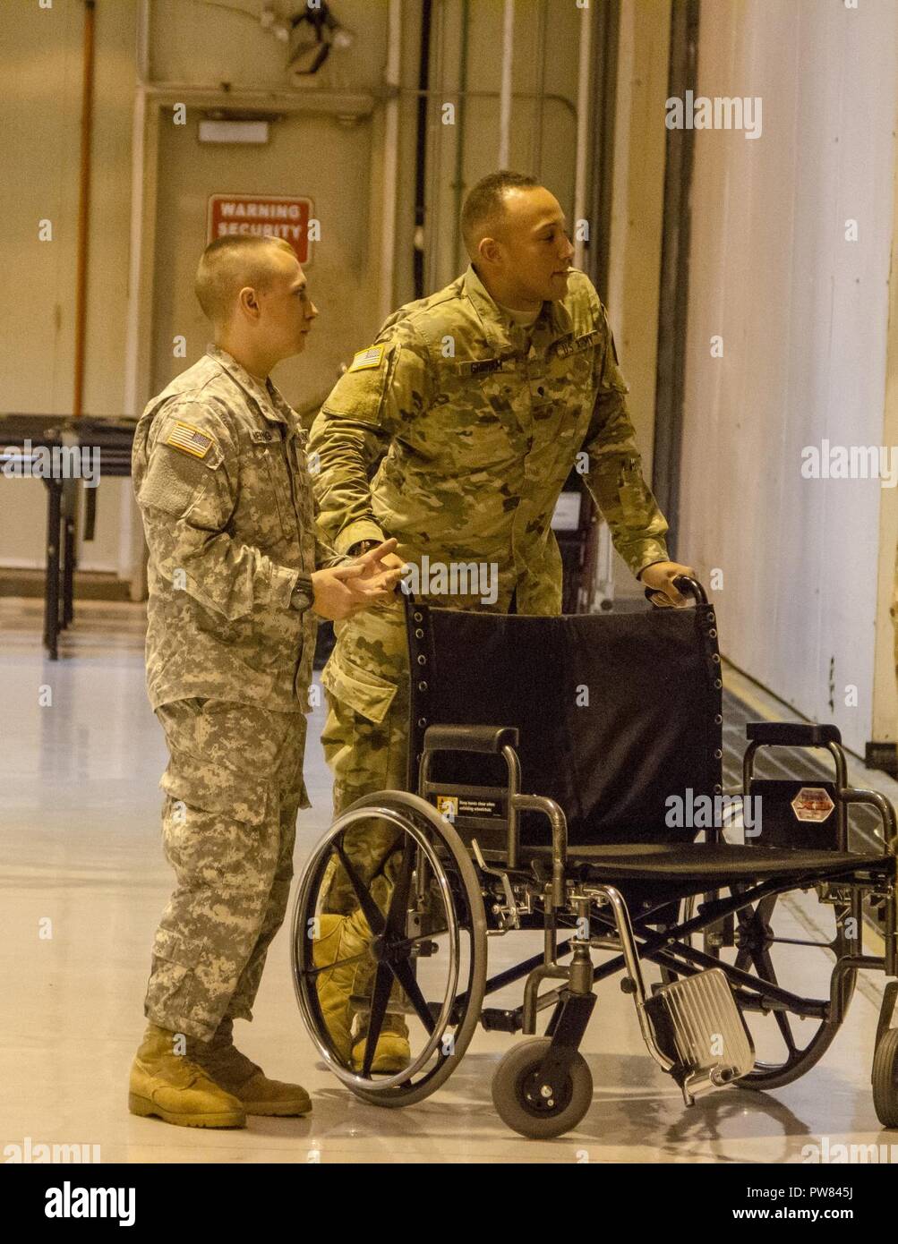 Spc. Benjamin Enneking (left), and Spc. Alexander Graham, both X-ray technicians with the U.S ...